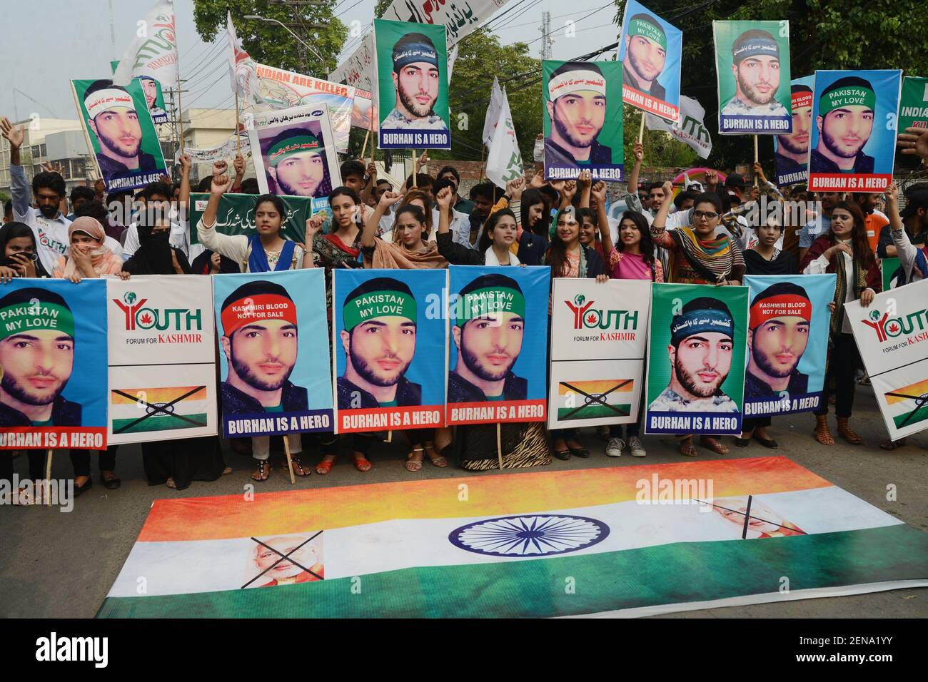 Pakistani activists of Youth Forum for Kashmir hold placards featuring ...