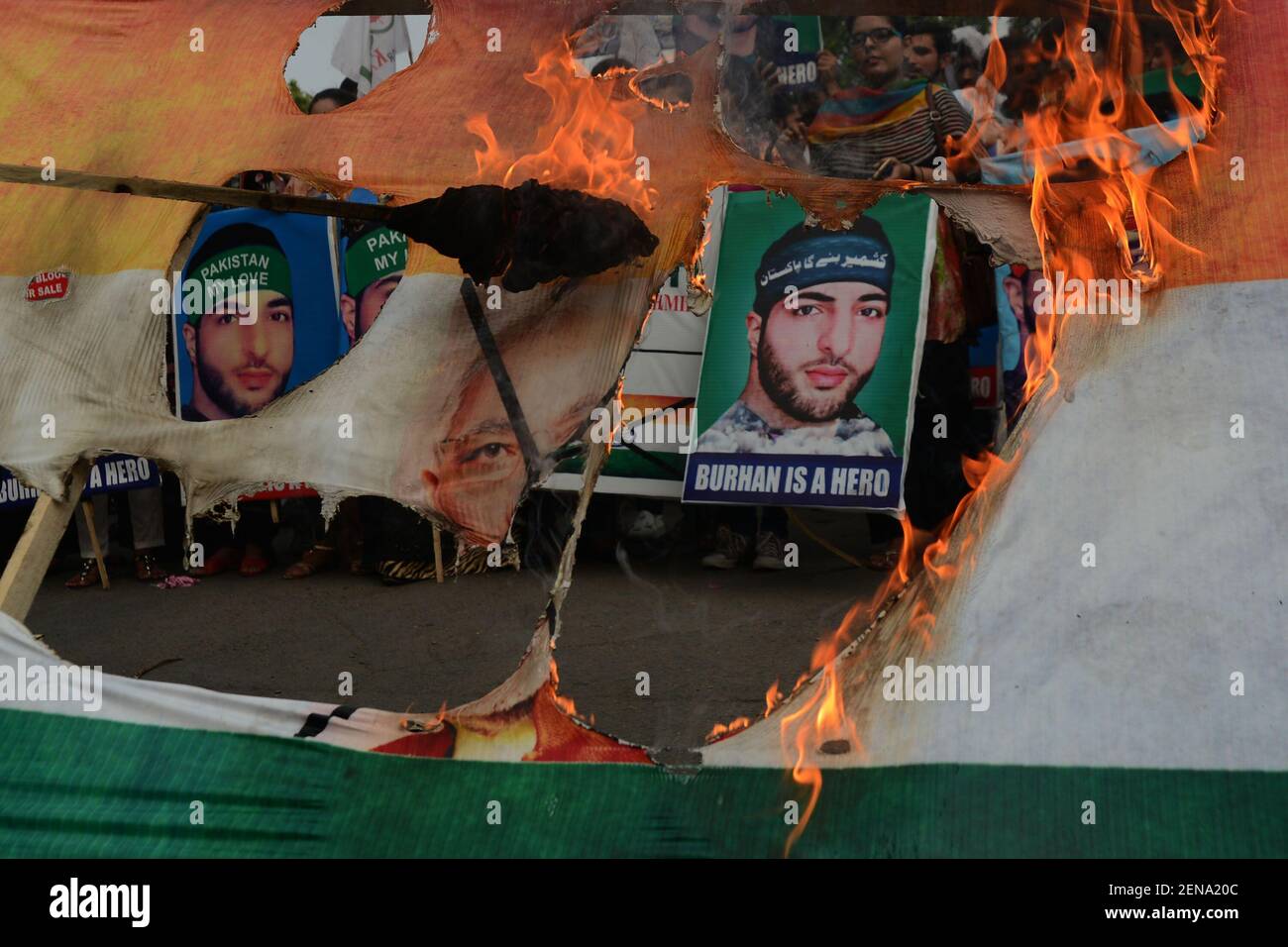 Pakistani activists of Youth Forum for Kashmir hold placards featuring ...