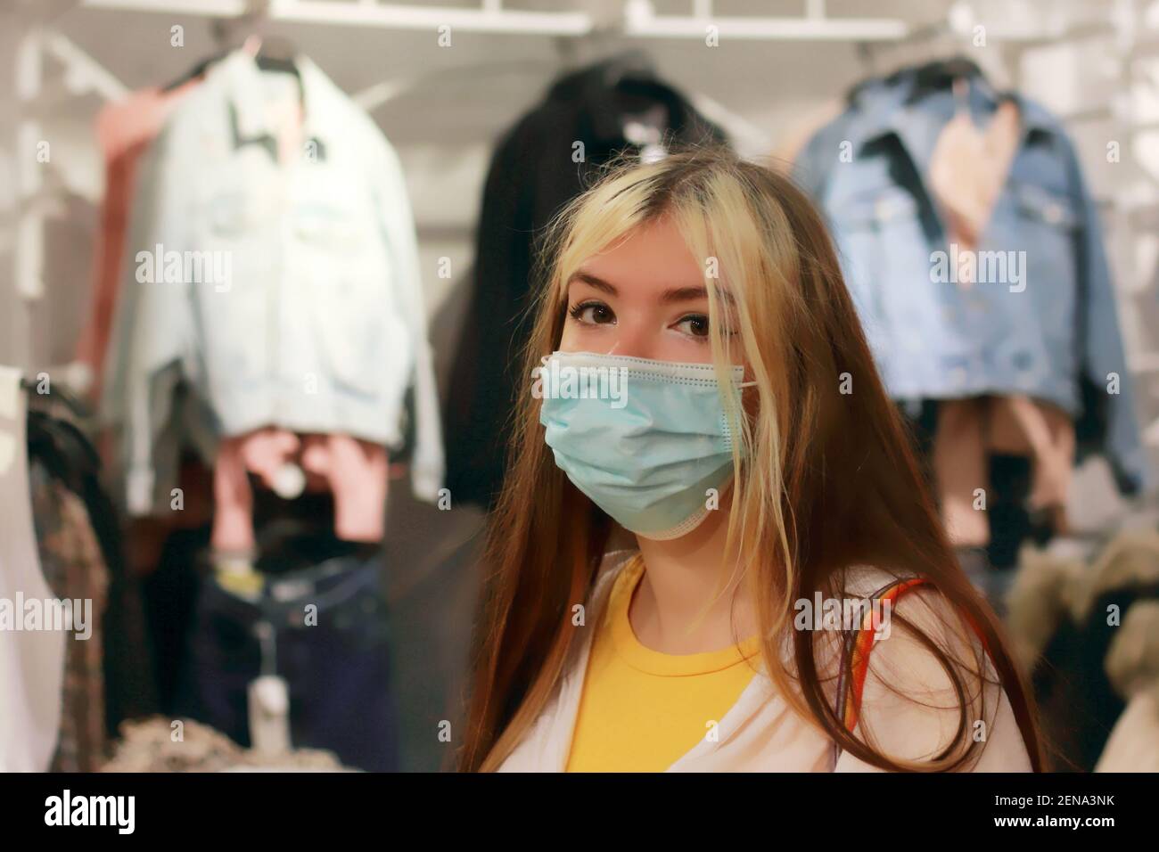 teen girl in a protective mask shopping Stock Photo - Alamy