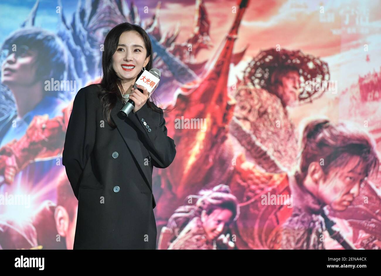 Chinese actress and singer Yang Mi, dressing in a black suit, attends a ...