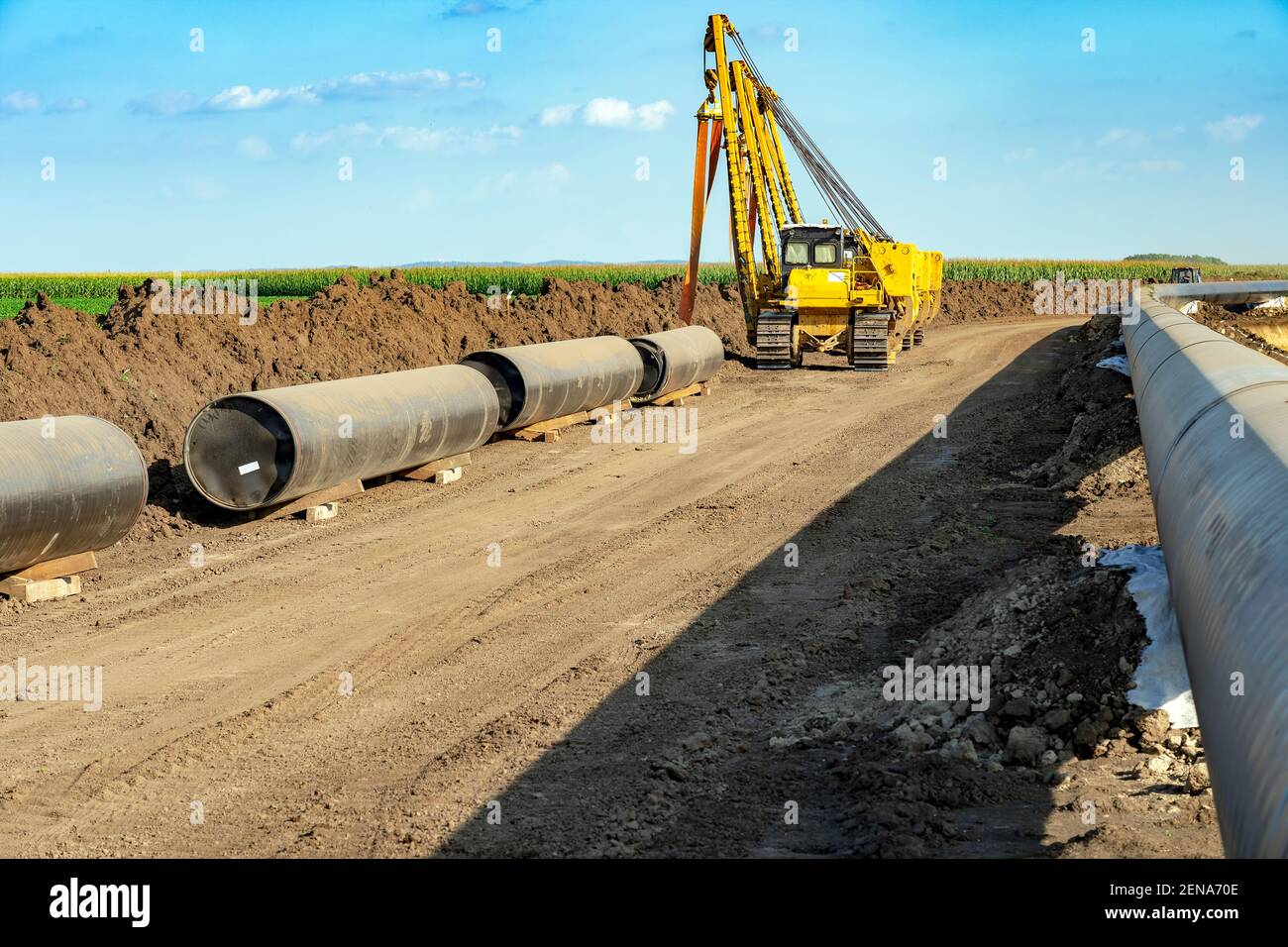 Heavy Machinery and Gas Pipeline Construction Site. Pipes are Laid on ...