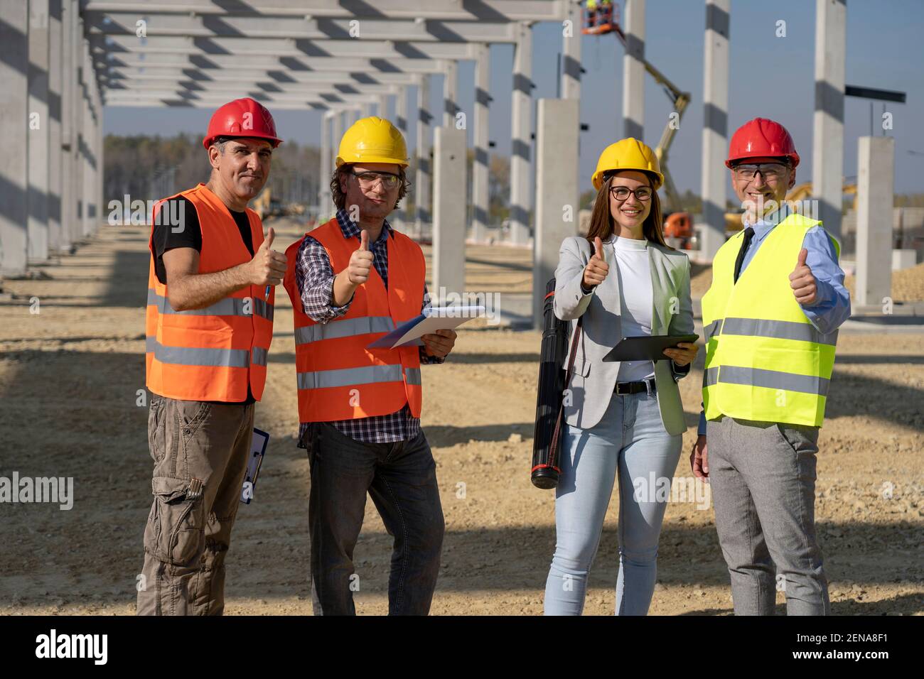 Group of Business People in Hardhats With Thumbs Up on Construction ...