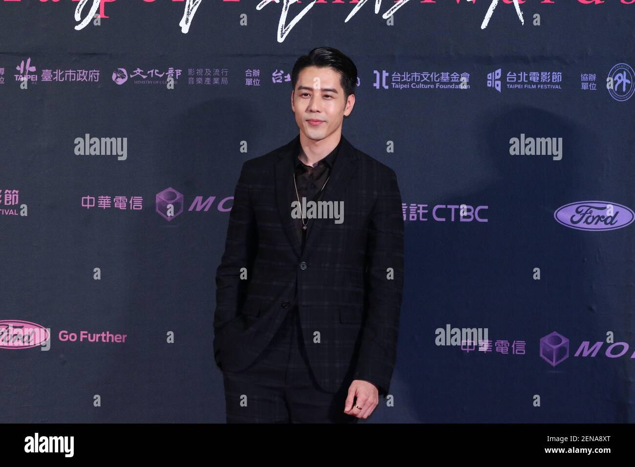American-born actor and singer George Hu poses as he arrives on the red ...