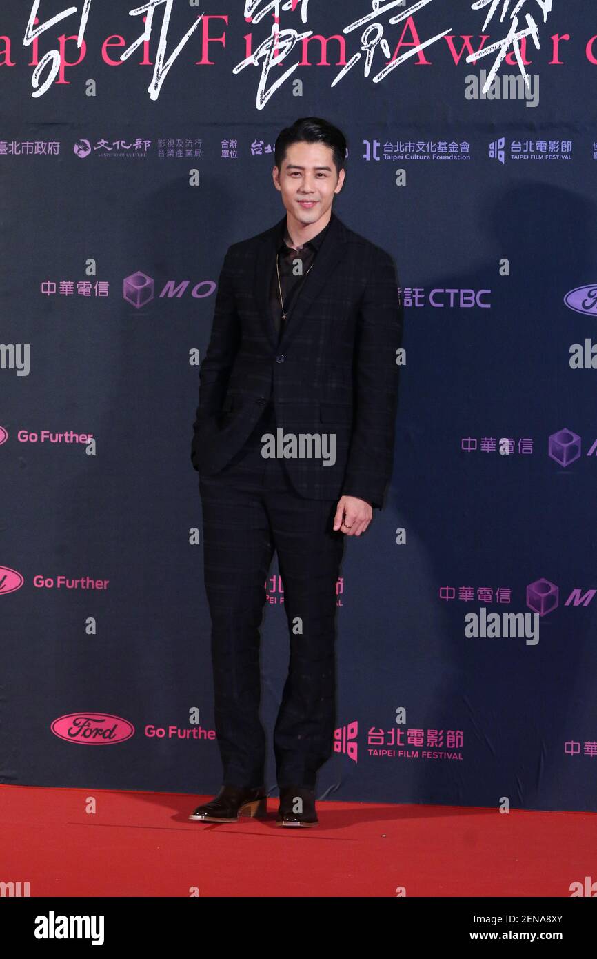 American-born actor and singer George Hu poses as he arrives on the red ...