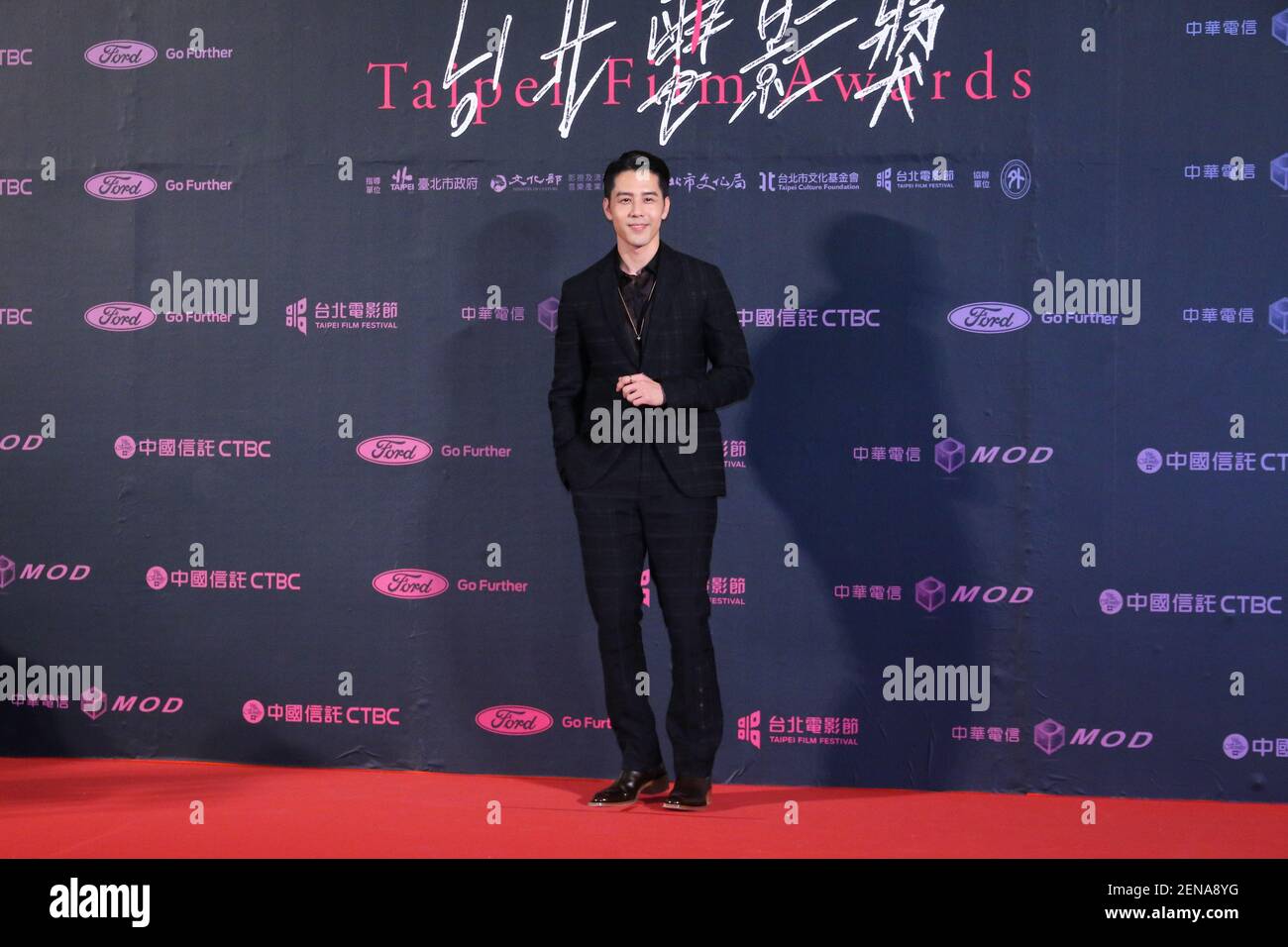 American-born actor and singer George Hu poses as he arrives on the red ...