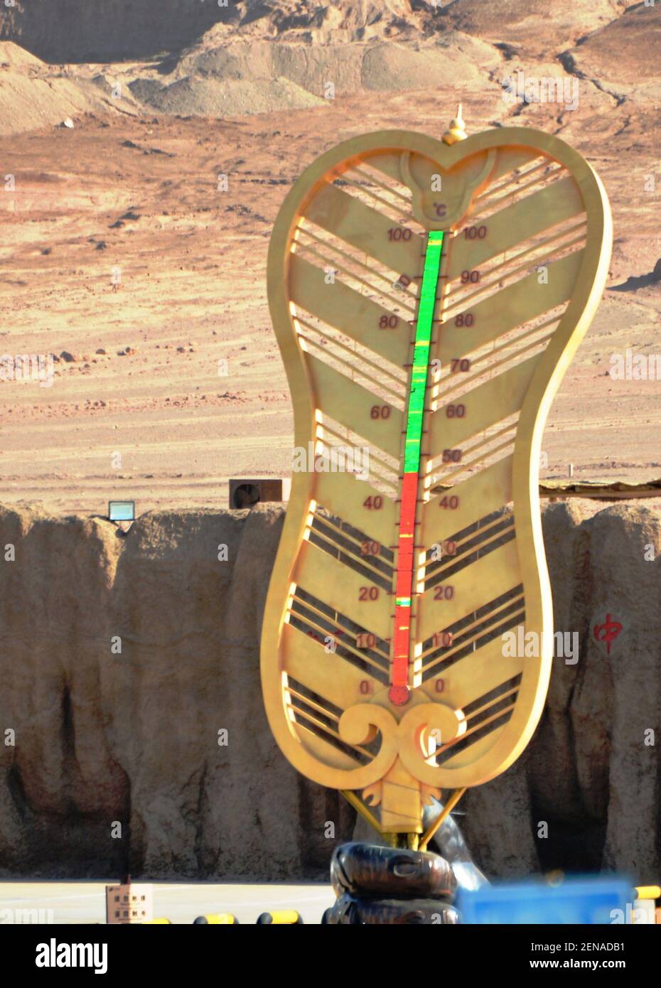A giant thermometer featuring shape of Plantain Fan shows the current ...