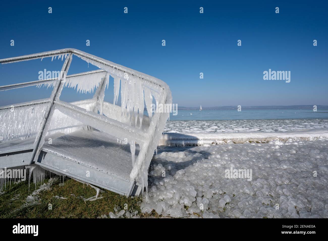 Beautiful frozen Lake Balaton with steel steps Stock Photo - Alamy