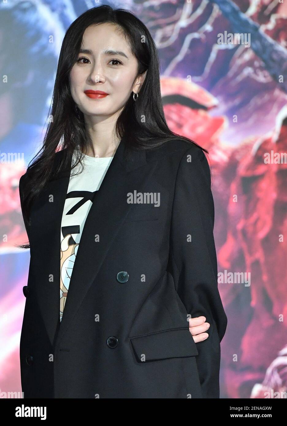 Chinese actress and singer Yang Mi, dressing in a black suit, attends a ...