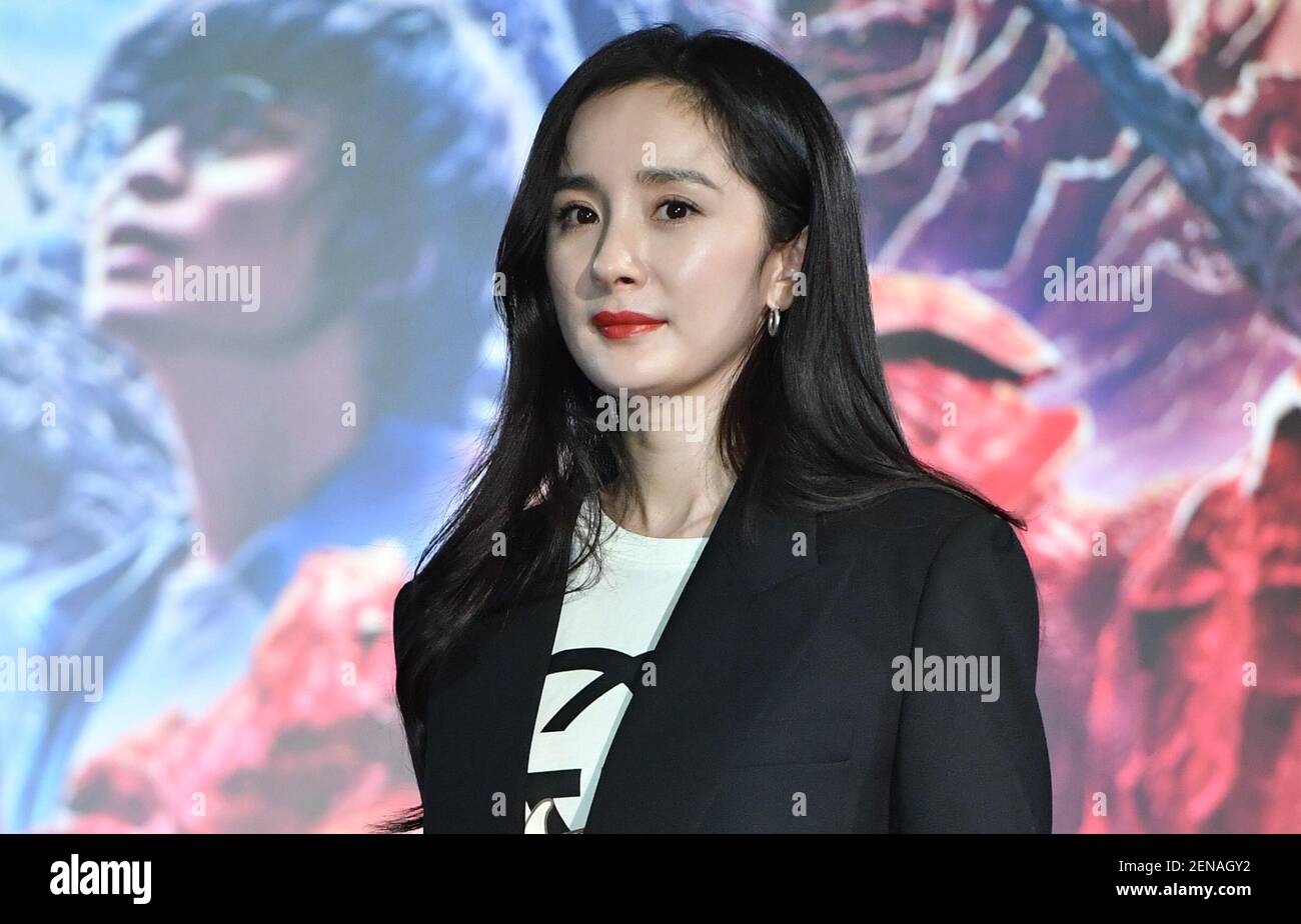 Chinese actress and singer Yang Mi, dressing in a black suit, attends a ...