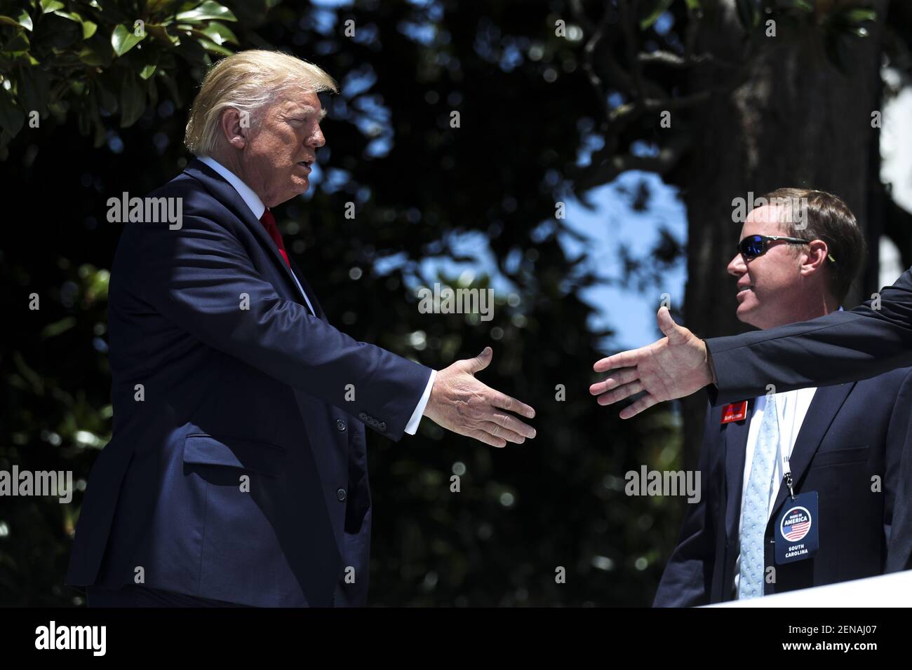 President Donald Trump inspect the Freeman Boatworks on display to ...