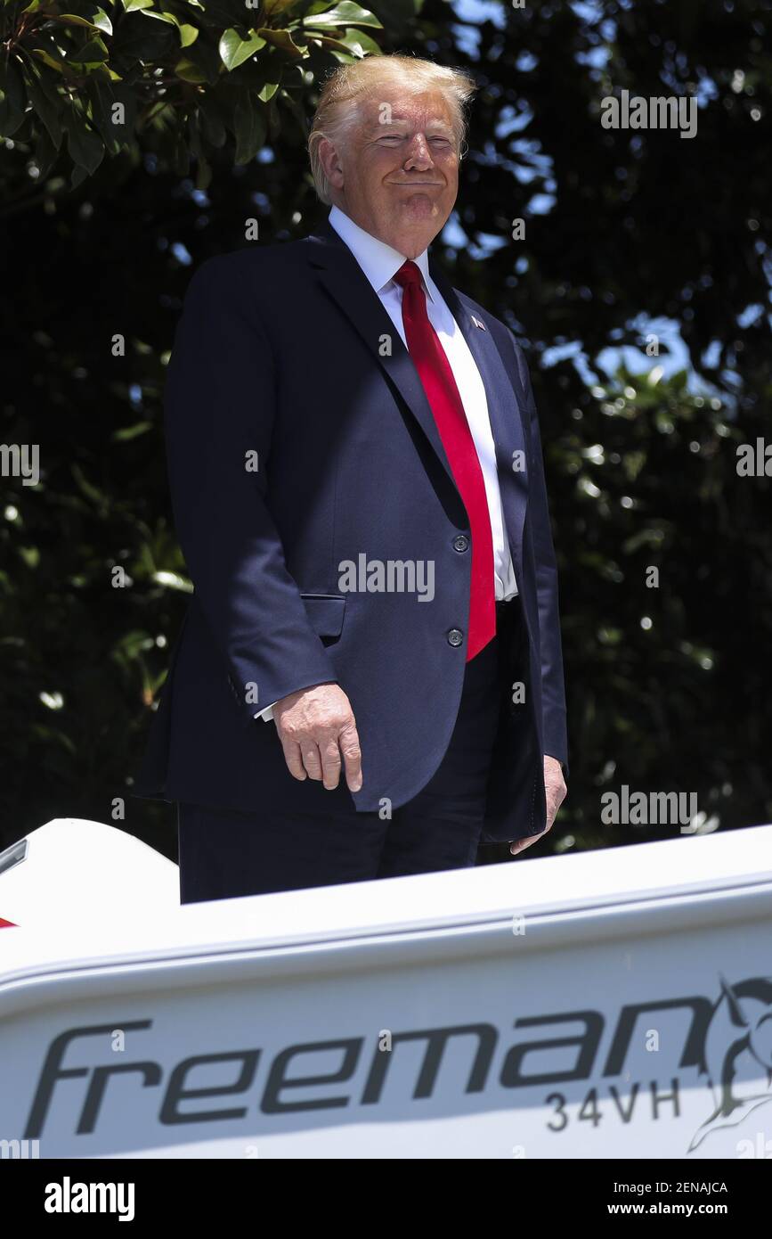 President Donald Trump inspect the Freeman Boatworks on display to ...