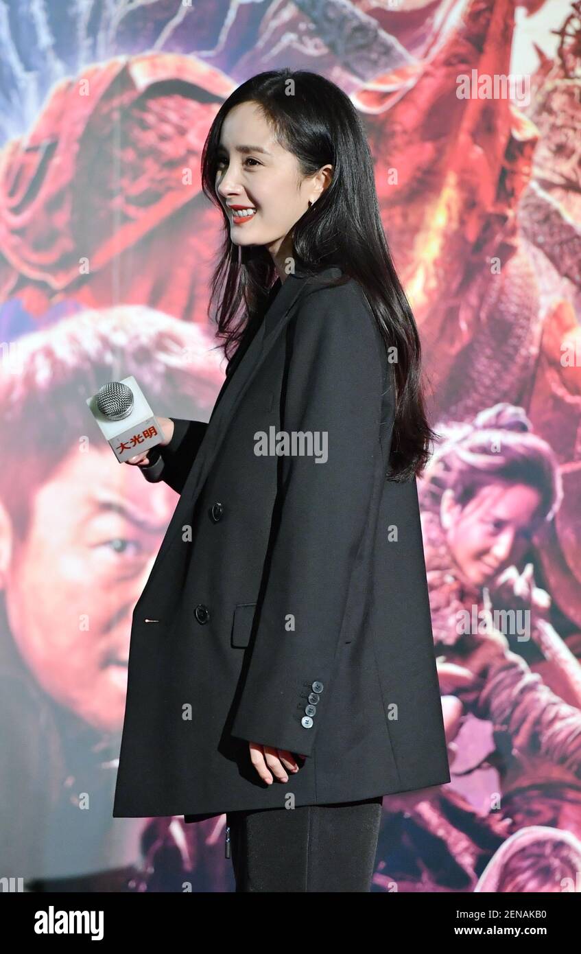 Chinese actress and singer Yang Mi, dressing in a black suit, attends a ...