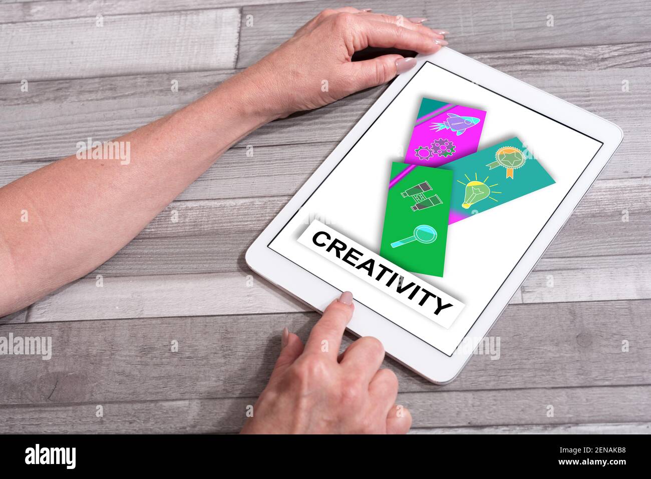 Creativity concept shown on a tablet used by a woman Stock Photo - Alamy