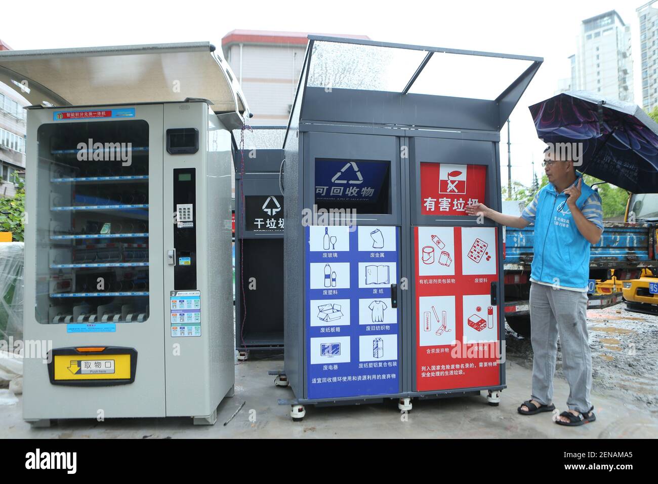 The man Niu Guangcheng from Gumei community's environment service ...