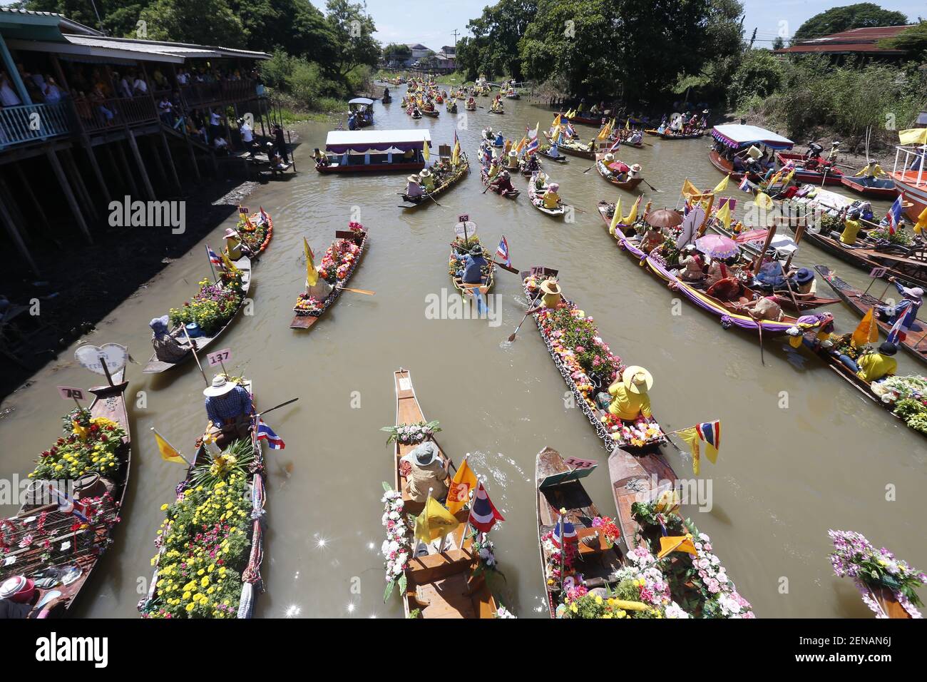 Boats carrying wax castle move along a canal to take part in a colorful procession ahead of the ...