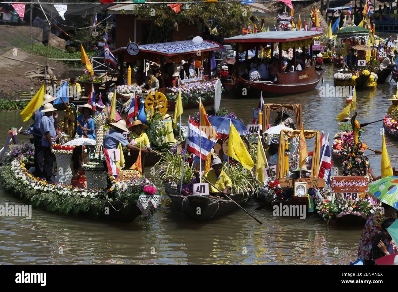 Boats carrying wax castle move along a canal to take part in a colorful procession ahead of the ...