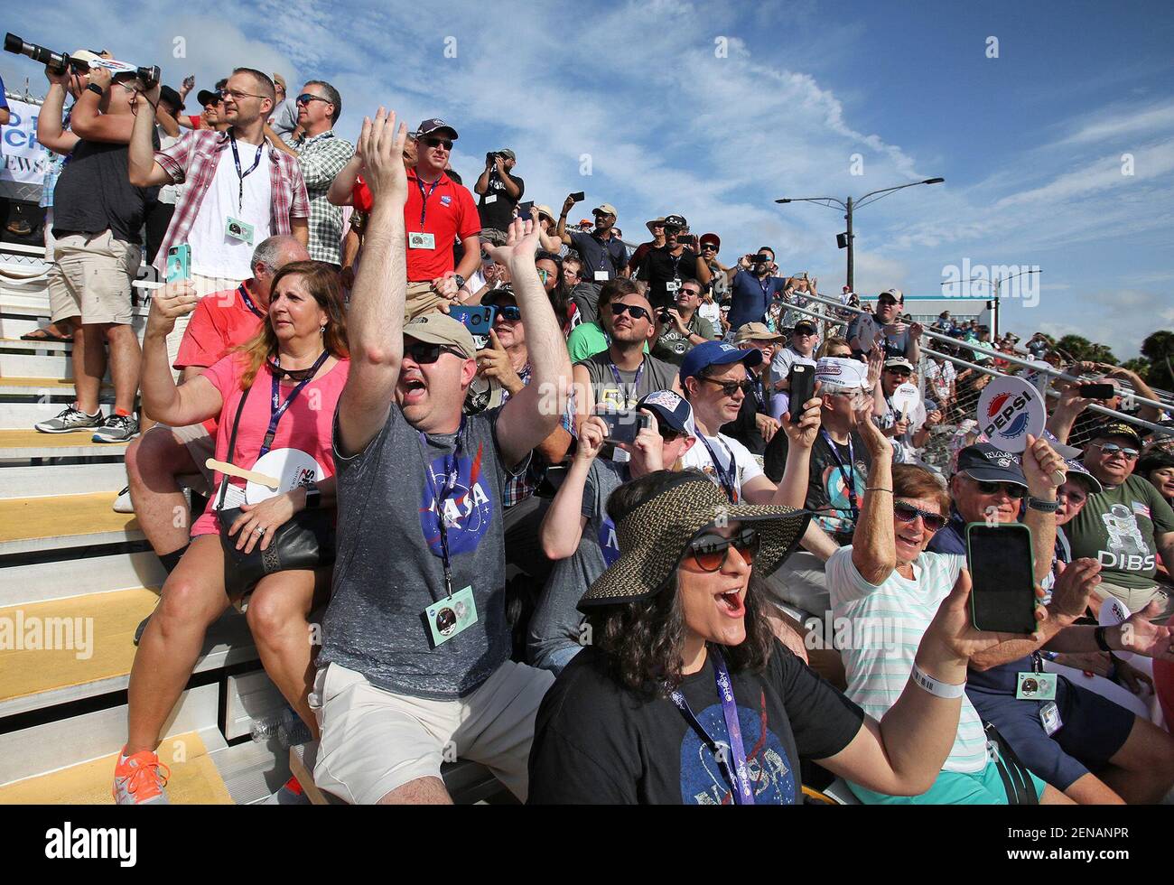 Space fans cheer at the moment of lift-off during the Apollo 11 Launch ...