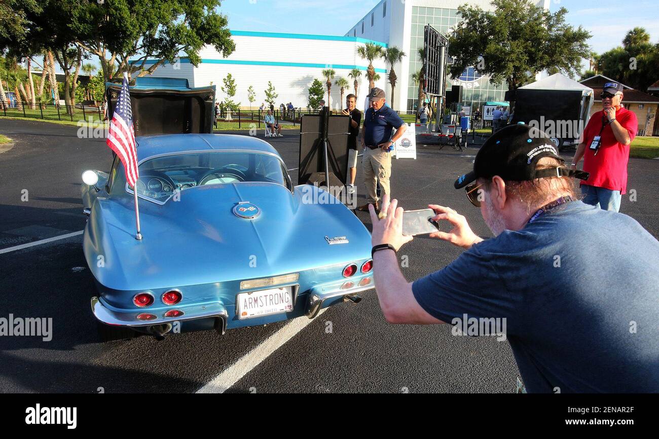 A visitor takes a photo of Neil Armstrong's 1967 Sting Ray Corvette at ...