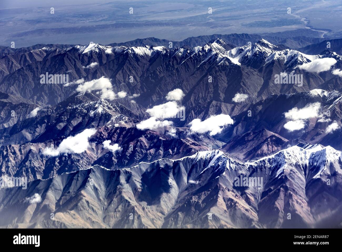 Aerial views of snow mountains in Xinjiang, the largest province in ...