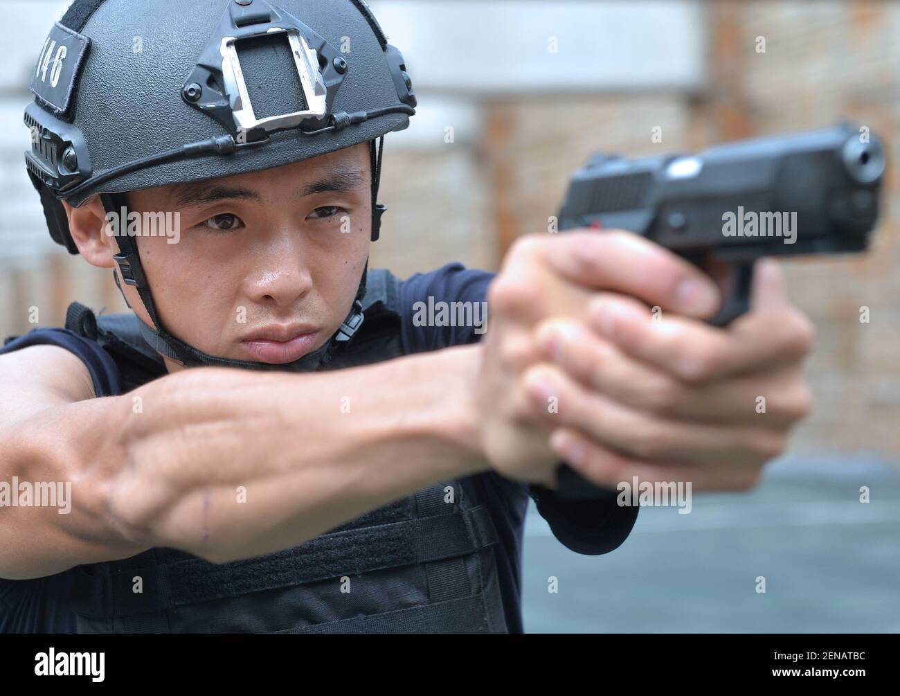 SWAT police officers competes in a pistol event during the 2019 World ...