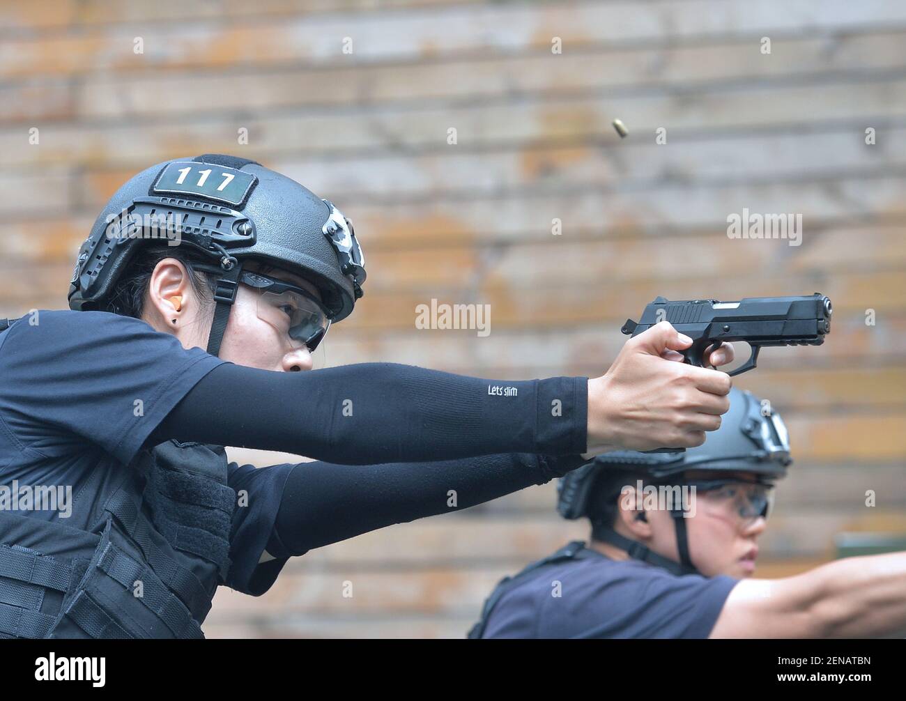 SWAT police officers competes in a pistol event during the 2019 World ...