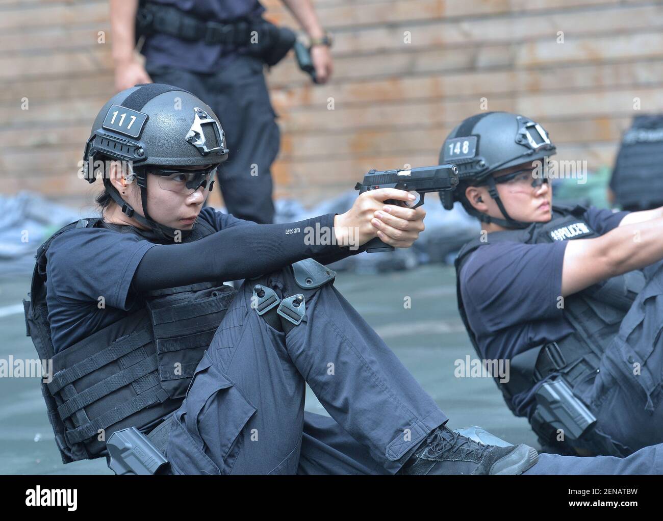 SWAT police officers competes in a pistol event during the 2019 World ...