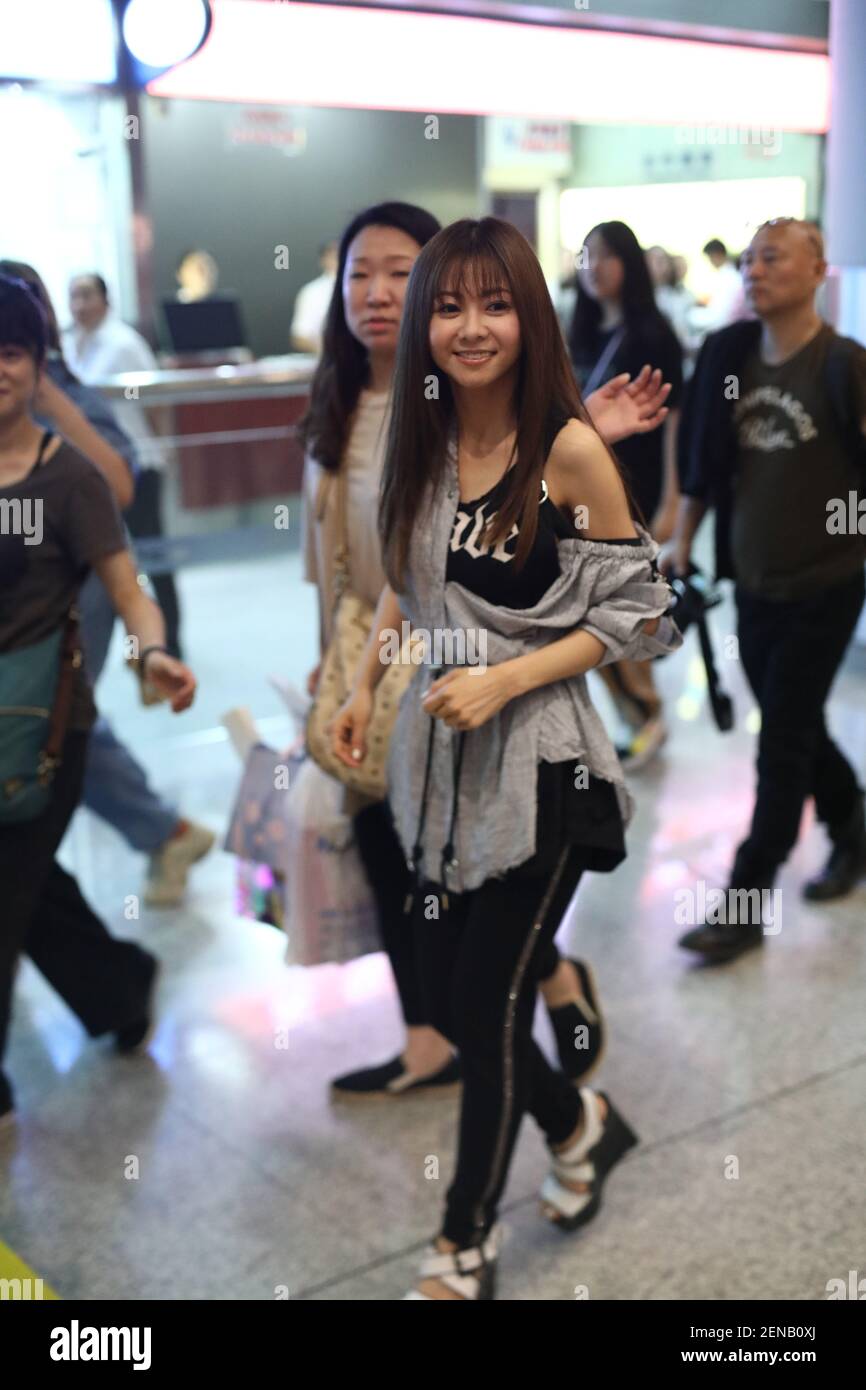 Japanese singer Mai Kuraki arrives at the Beijing Capital International Airport after landing ...