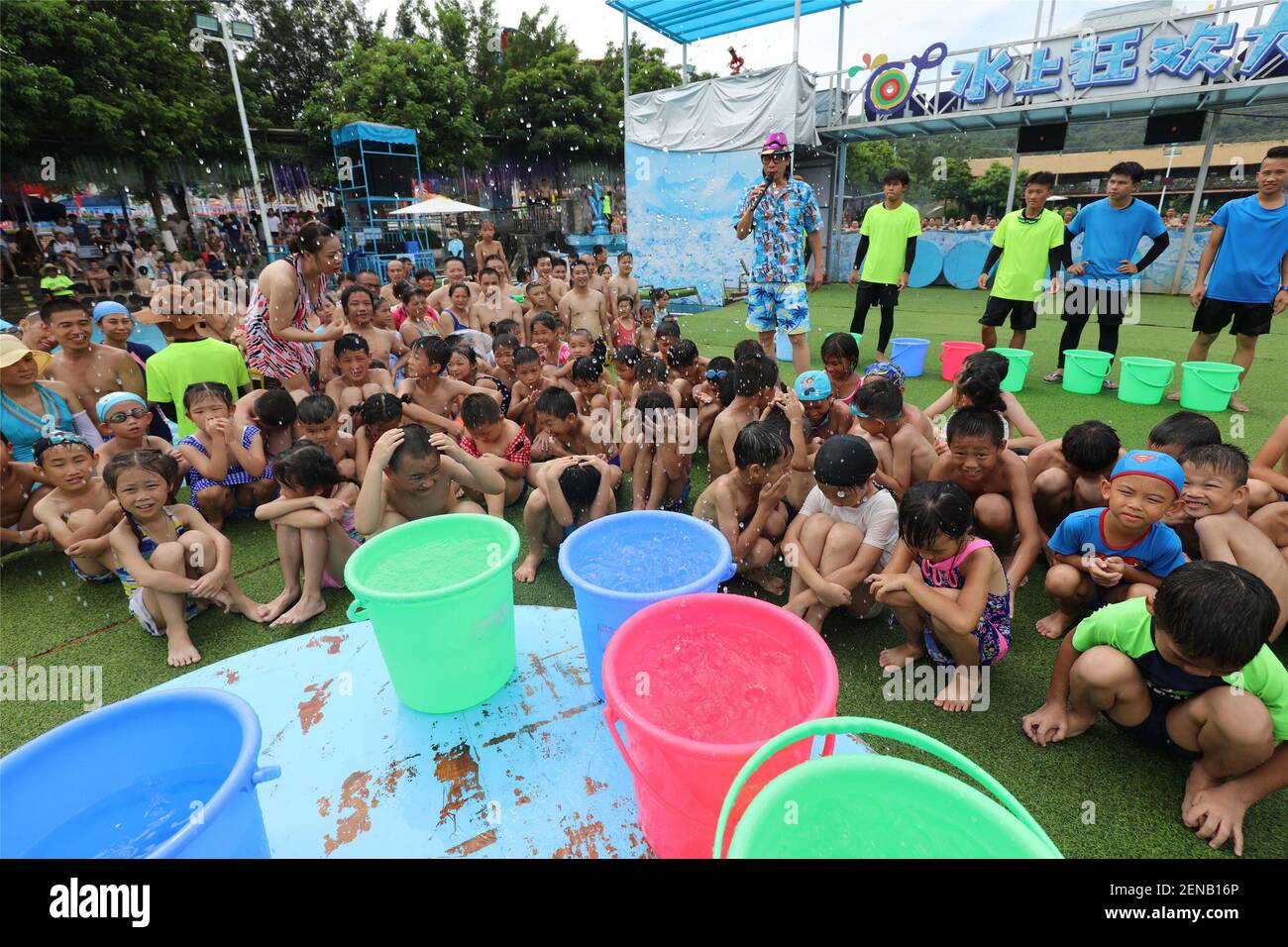 Chinese holidaymakers crowd a swimming pool at a water park on a ...