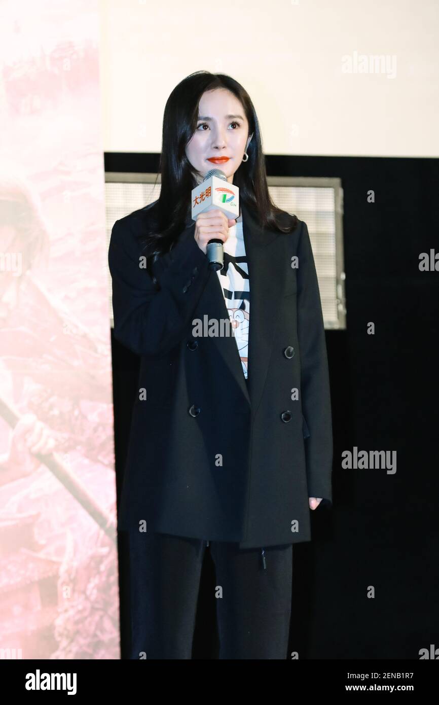 Chinese actress and singer Yang Mi, dressing in a black suit, attends a ...
