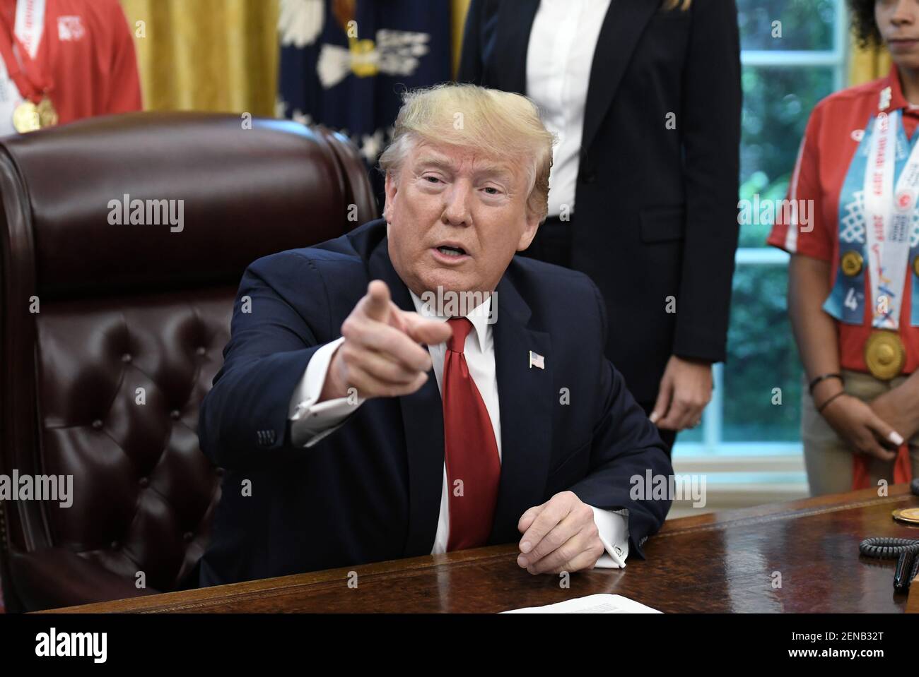 US President Donald Trump answers questions from reporters during a ...