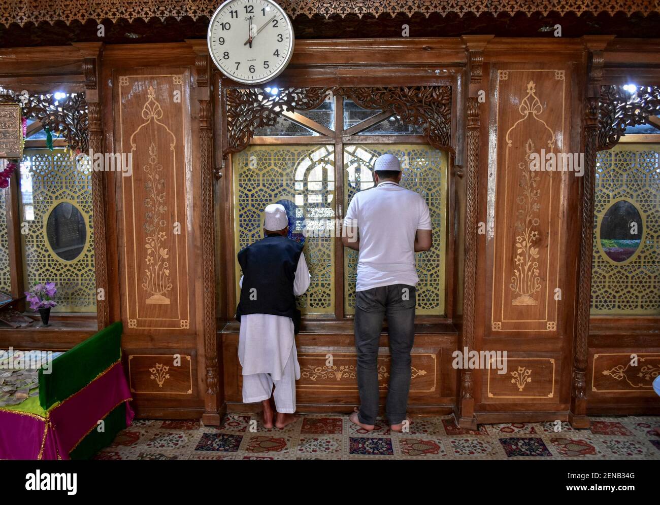 Kashmiri devotees pray at the shrine of Sheikh Noor-ud-Din Wali (RA) in Budgam district, about ...