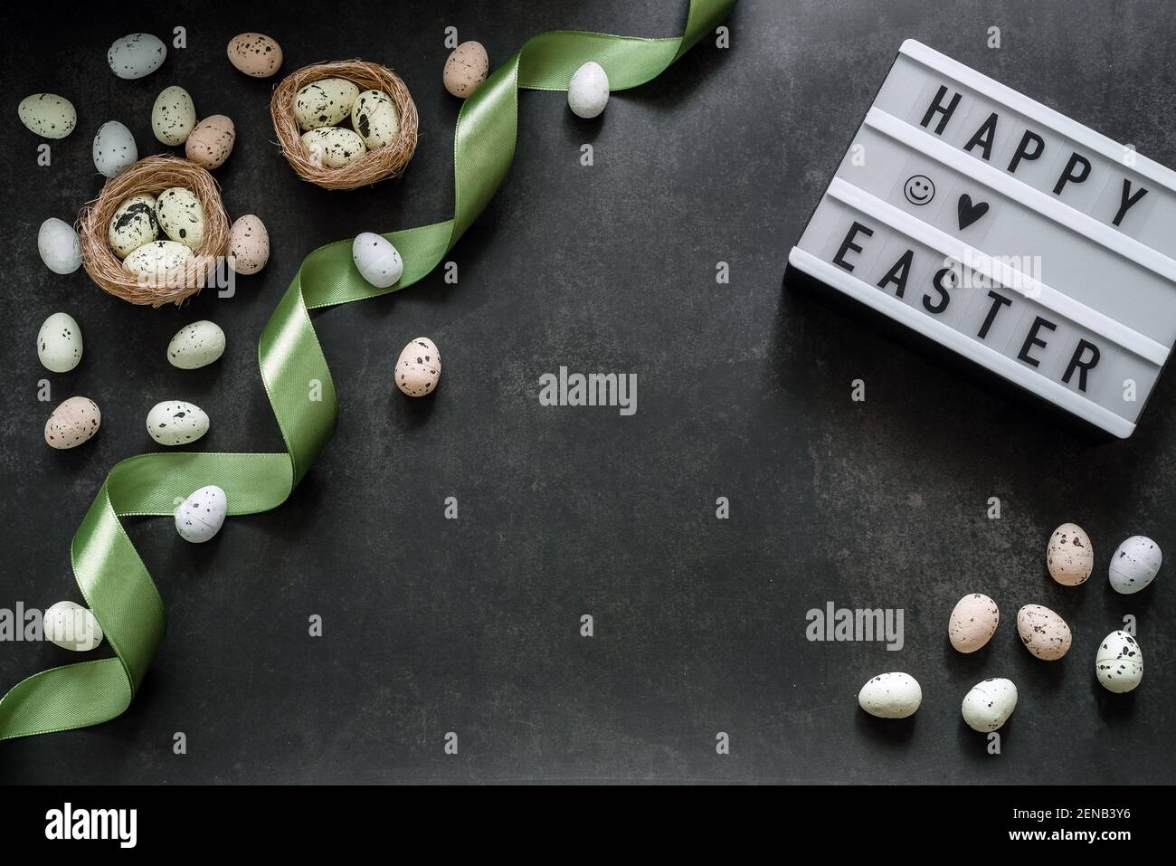 Happy Easter lightbox with colorful Easter eggs in bird's nest and ...