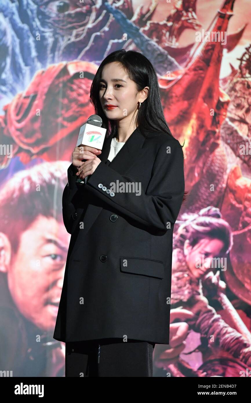 Chinese actress and singer Yang Mi, dressing in a black suit, attends a ...