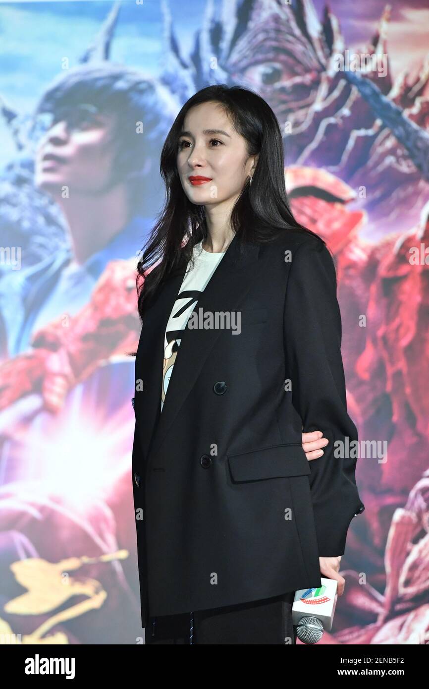 Chinese actress and singer Yang Mi, dressing in a black suit, attends a ...