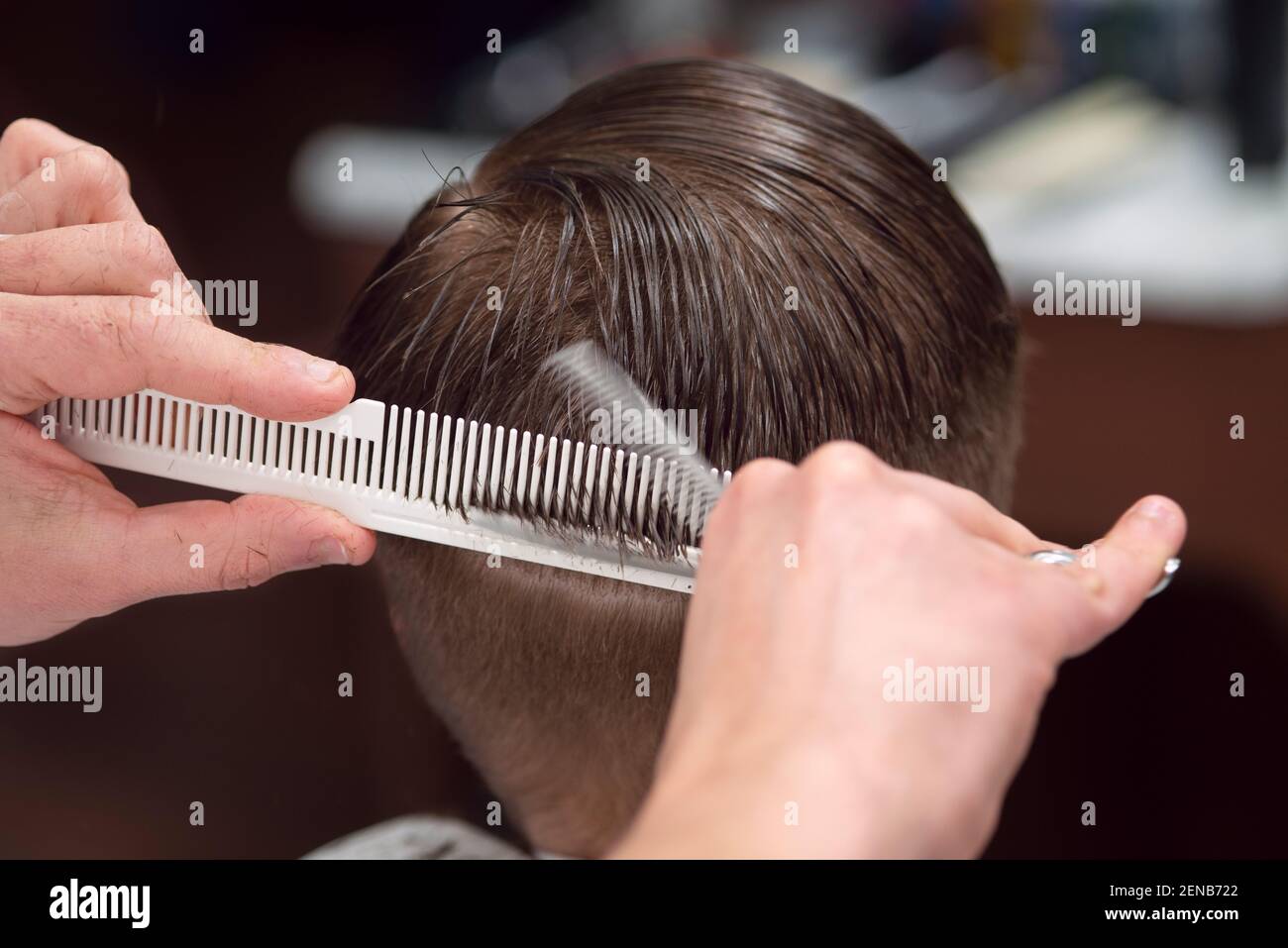 Barber hand cutting hair boy barber hi-res stock photography and images ...