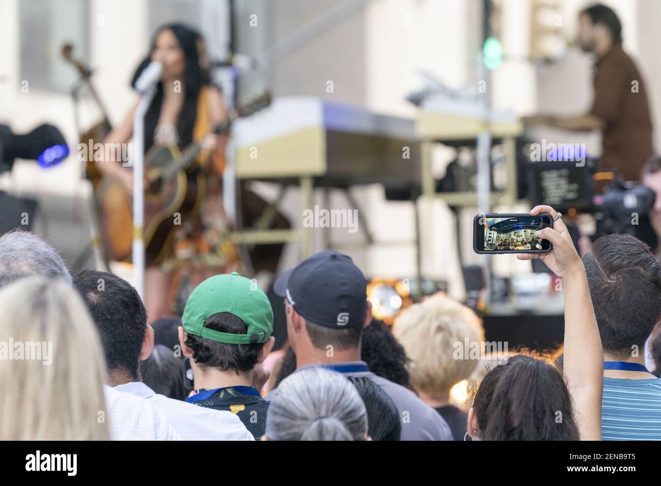 Fan recording on cell phone as singer Kasey Musgraves performs on NBC ...