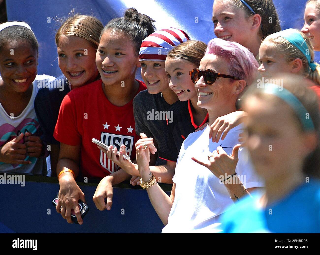 U.S. Women's National Soccer Team co-captain Megan Rapinoe, right ...