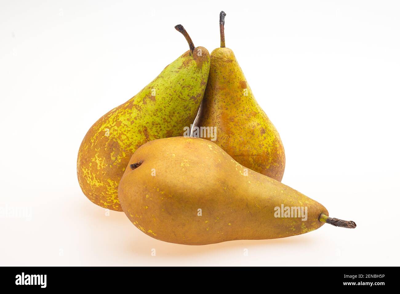 Fresh pears, three yellow fruit isolated on white background Stock ...