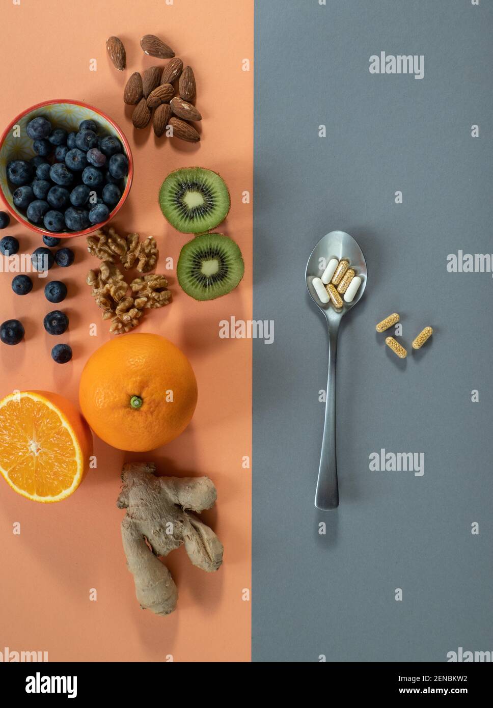 Comparison of fresh healthy fruits and food supplements Stock Photo - Alamy