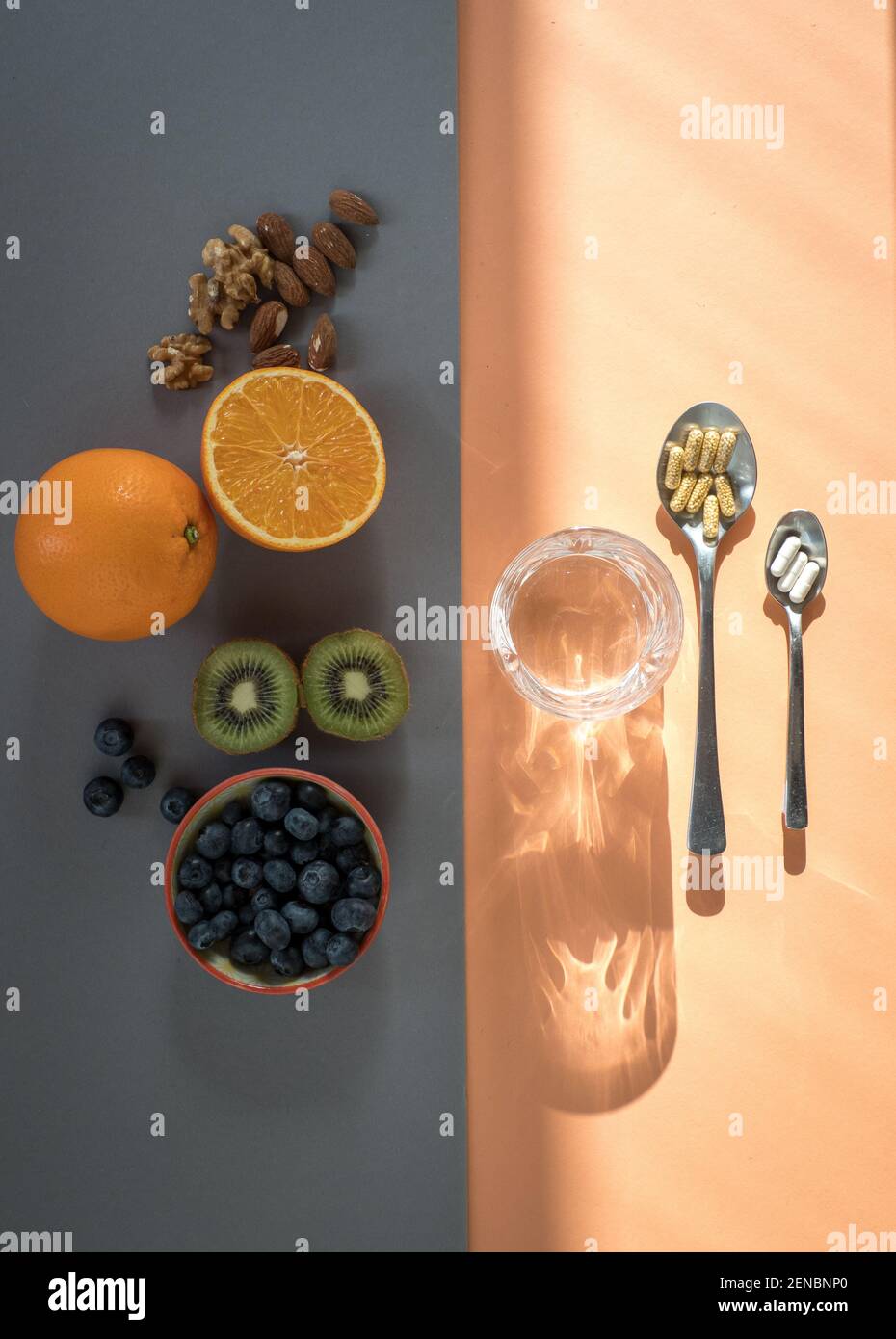 Comparison of fresh healthy fruits and food supplements Stock Photo - Alamy