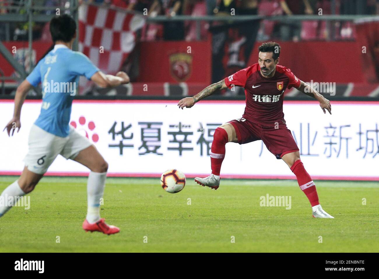 Argentine football player Ezequiel Lavezzi, right, of Hebei China ...