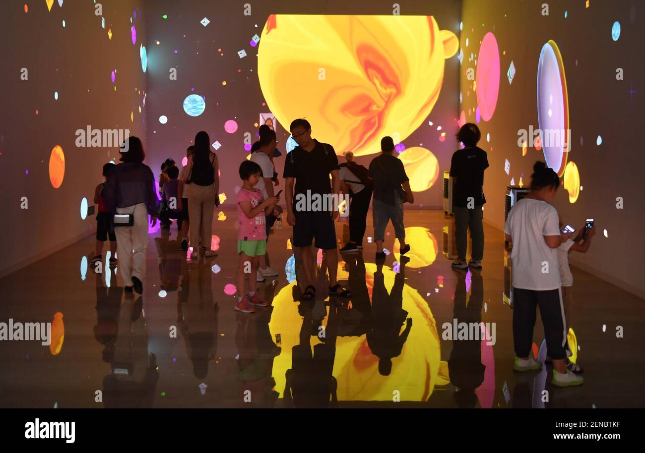 Chinese parents and their kids visit the interactive science exhibition ...