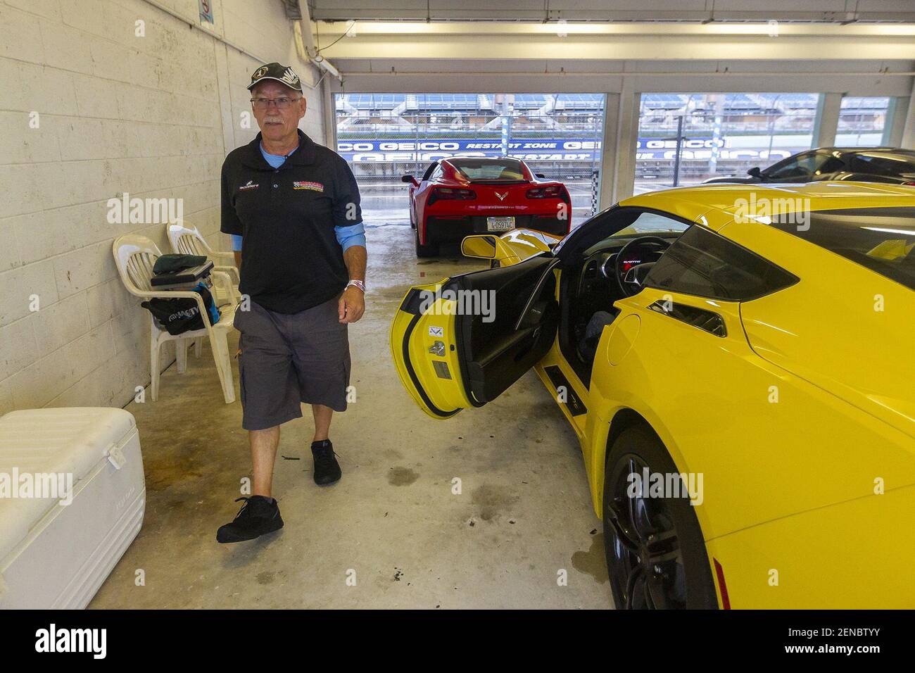 Randy Lanier, 64, walks through a garage during his weekend job as a ...