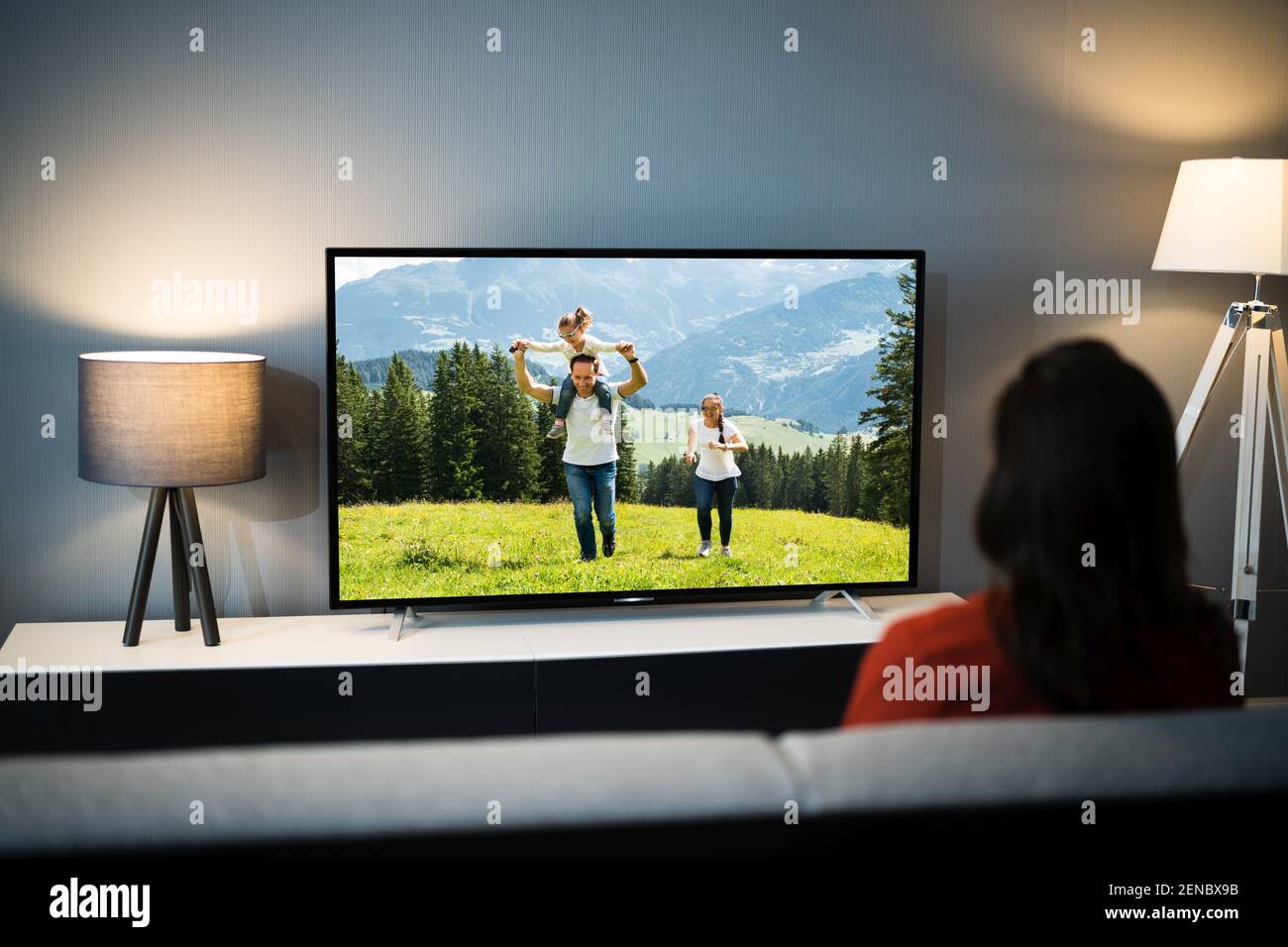 Woman Watching TV Movie At House Room Stock Photo - Alamy