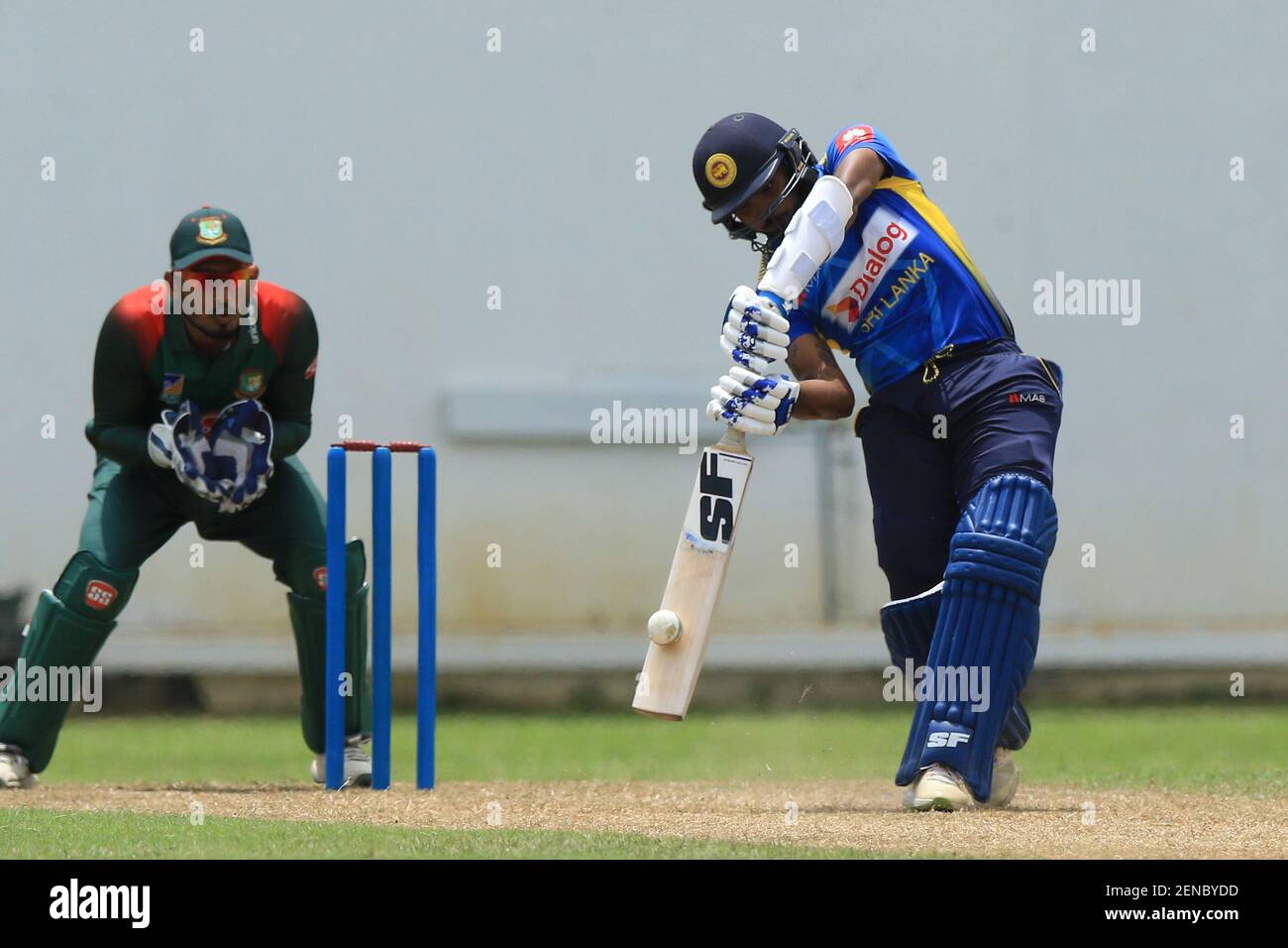 Sri Lankan cricketer Wanidu Hasaranga plays a shot watched by ...