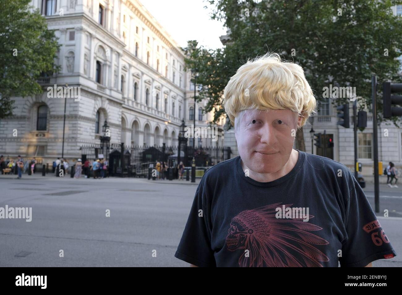 A protester wearing a Boris Johnson's mask and a fake blonde wig ...