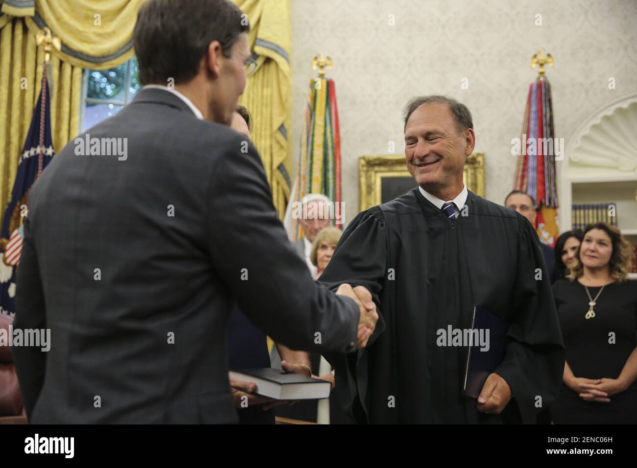 Mark Esper, left, shakes hands with Associate Justice Samuel Alito ...