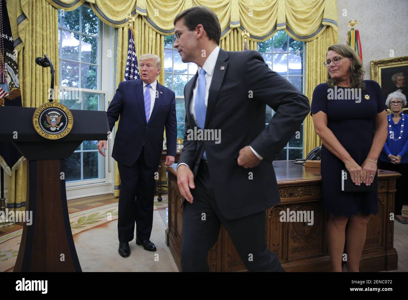 Defense Secretary Mark Esper, joined by his wife Leah Esper and ...