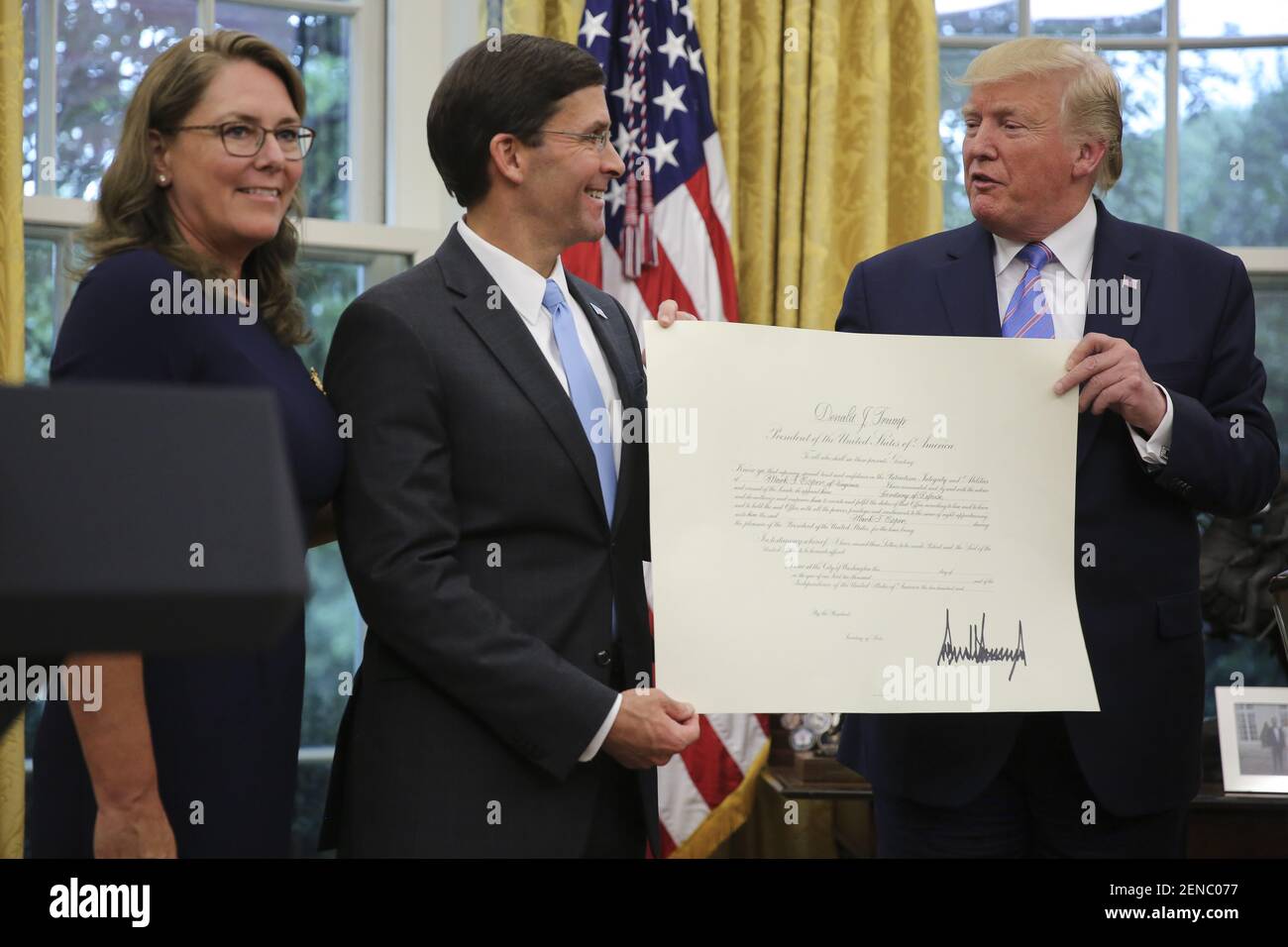 Defense Secretary Mark Esper poses with President Donald Trump and his ...