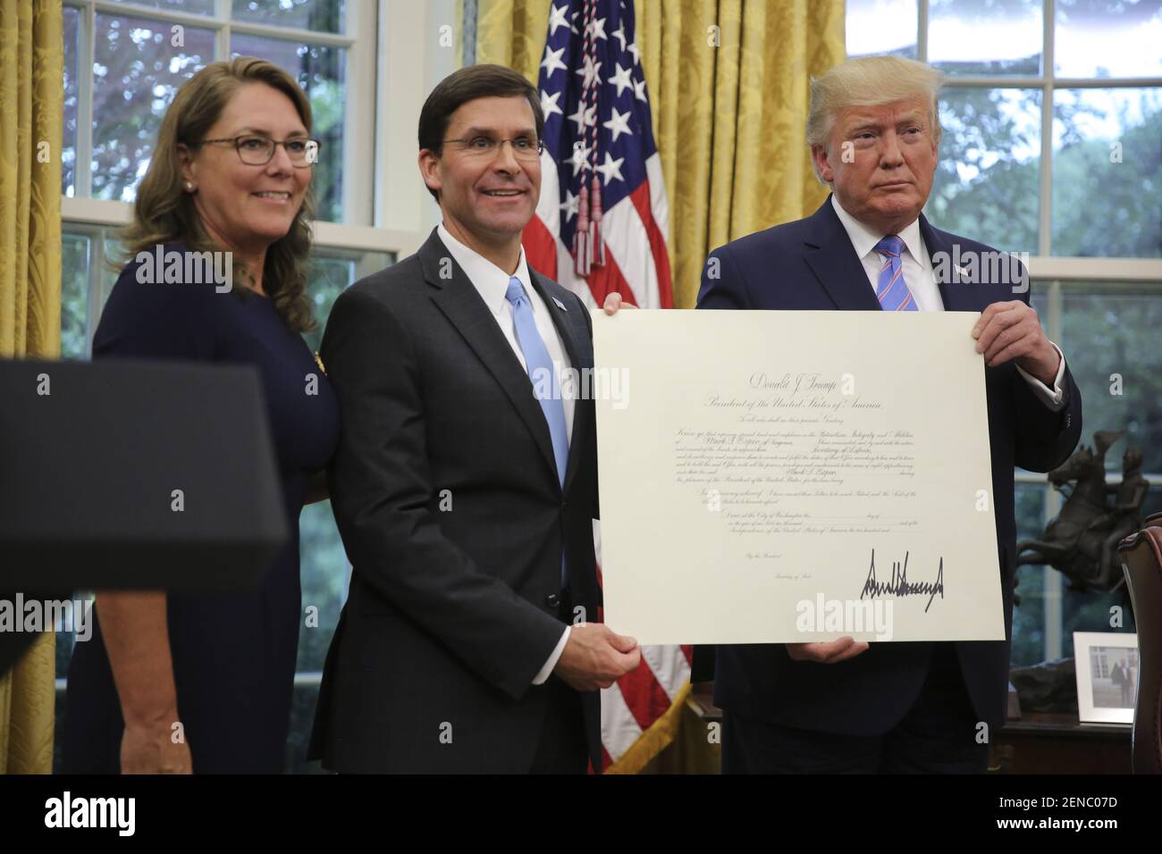 Defense Secretary Mark Esper poses with President Donald Trump and his ...